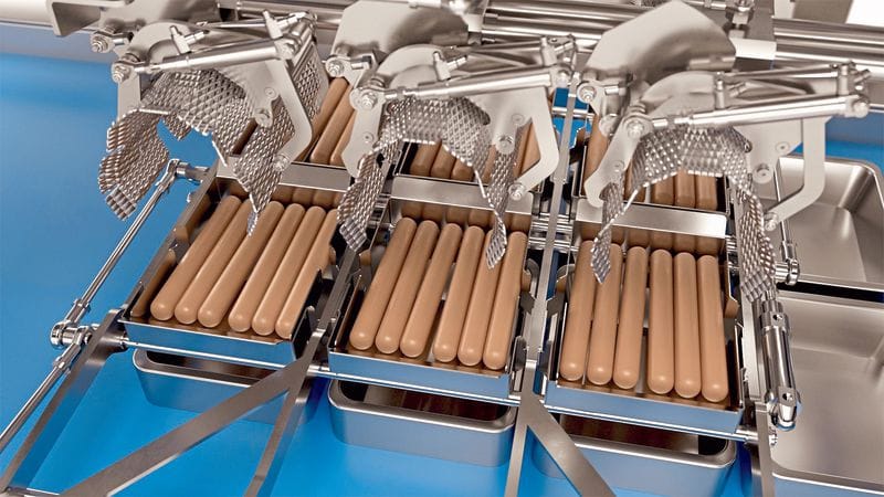 Pack sausages efficiently in neat layers - Die Fleischerei
